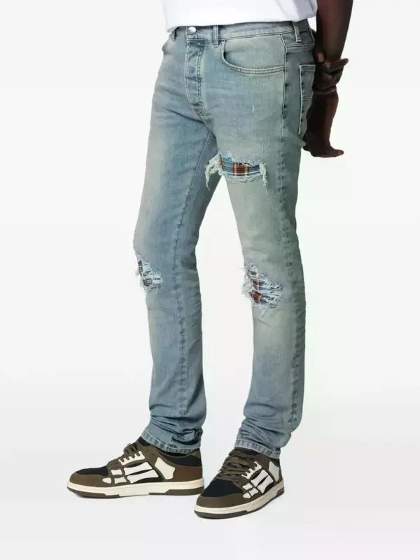 Amiri Distressed-effect Patched Jeans