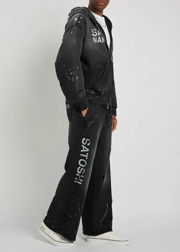 SATOSHI NAKAMOTO Luke Printed Distressed Wide-leg Cotton Sweatpants - Black