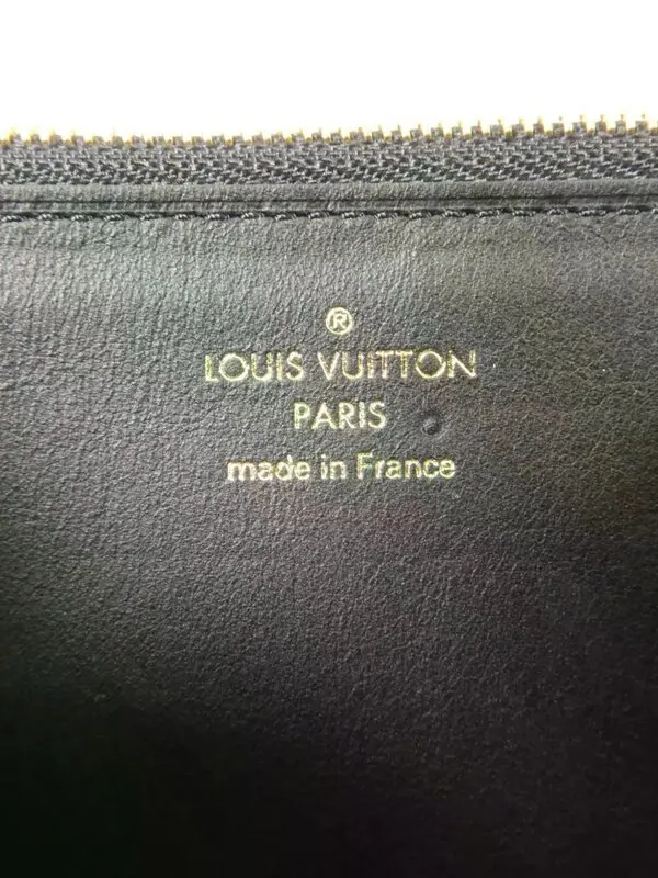 LOUIS VUITTON Capucines Studded Wallet