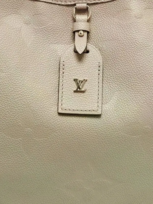 LOUIS VUITTON Carryall Mm Monogram Giant Empreinte Shoulder Bag - Neutrals