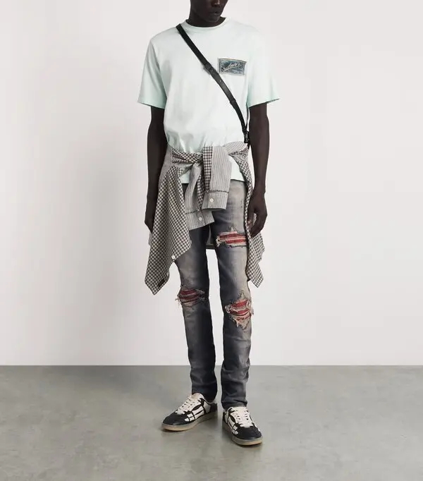 Amiri Ripped Skinny Jeans With Flannel Inlays