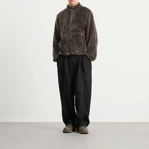 AND WANDER Crinkled Nylon Trousers