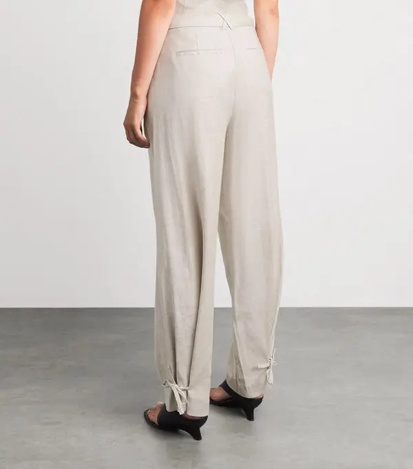 TOCCIN Linen-blend Elowen Trousers With Bow-tie Ankle Detail