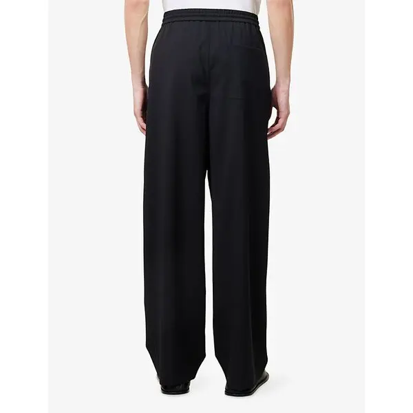 Loewe Anagram-embroidered Relaxed-fit Wool Trousers - Black