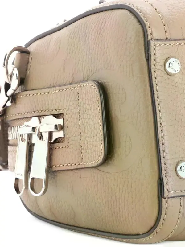 Gucci Jumbo Gg Embossed Leather Mini Travel Bag - Brown