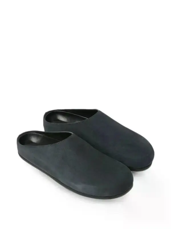 Studio Nicholson Wearing Leather Clogs