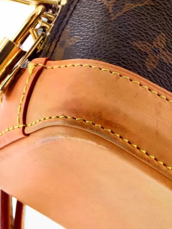 LOUIS VUITTON Alma Monogram Canvas Backpack
