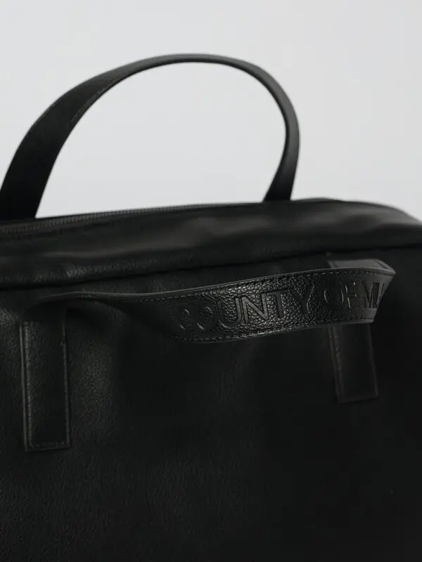 COUNTY OF MILAN Faux Leather Duffle Bag