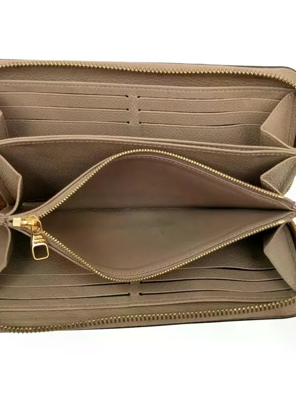 LOUIS VUITTON 2010-2026 Bicolor Monogram Empreinte Giant Zippy Wallet Long Wallets - Brown