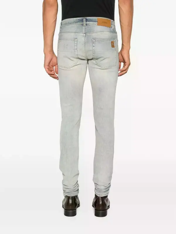 Amiri Stud-embellished Distressed Jeans