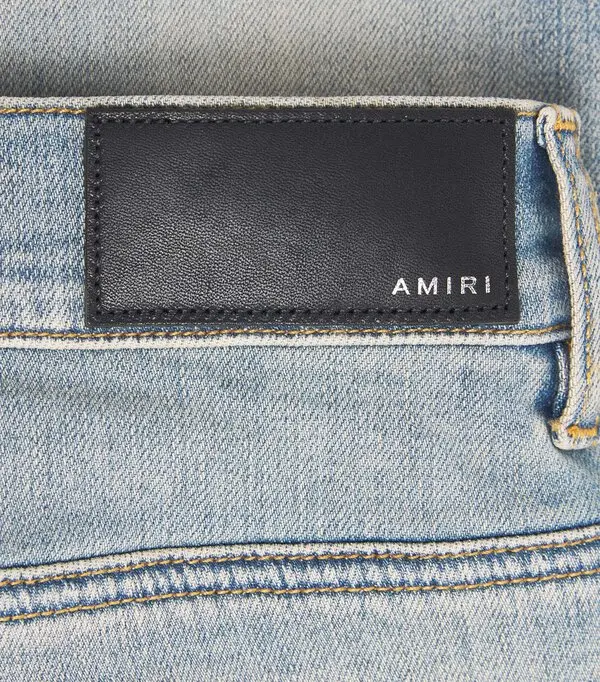 Amiri Ripped Ultrasuede Skinny Jeans
