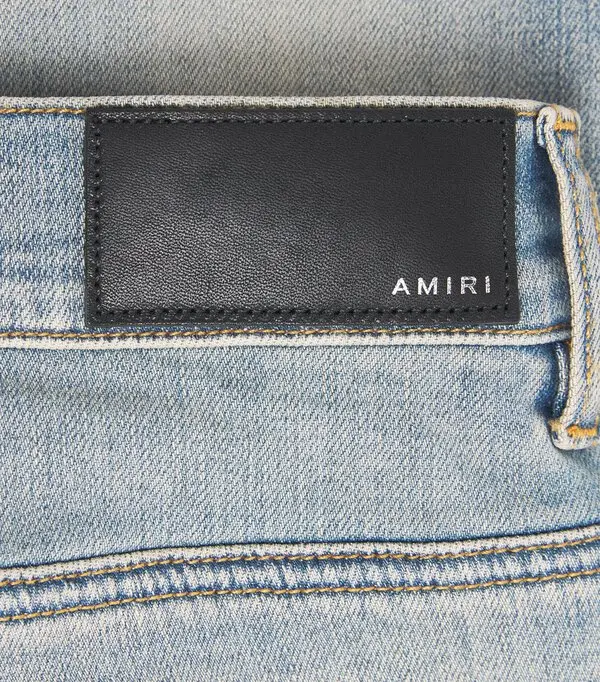Amiri Ripped Ultrasuede Skinny Jeans
