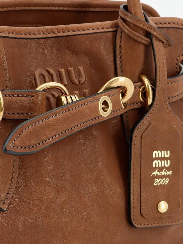 Miu Miu Aventure Leather Handbag With Embossed Lettering Logo