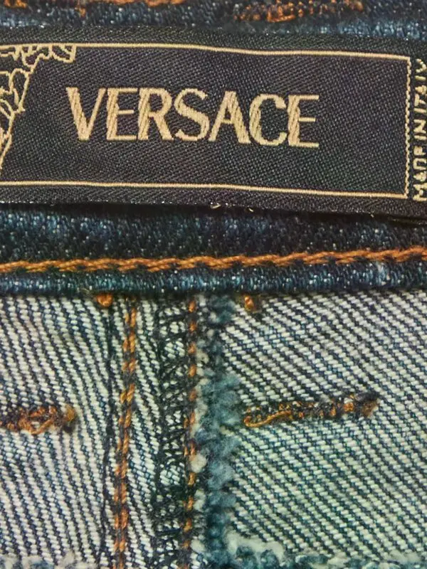 Versace Thigh-strap Flared Jeans