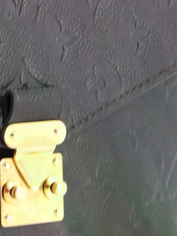 LOUIS VUITTON Monogram Empreinte Leather Pochette Métis Bag