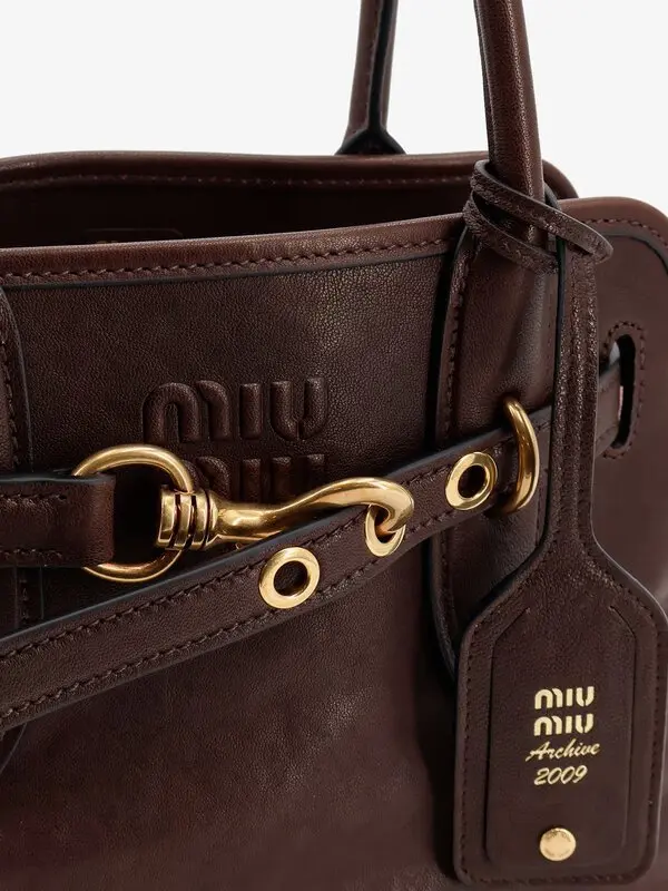 Miu Miu Aventure Leather Handbag With Embossed Lettering Logo