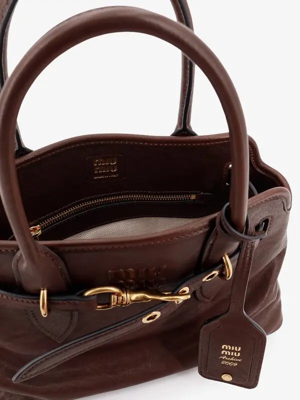 Miu Miu Aventure Leather Handbag With Embossed Lettering Logo