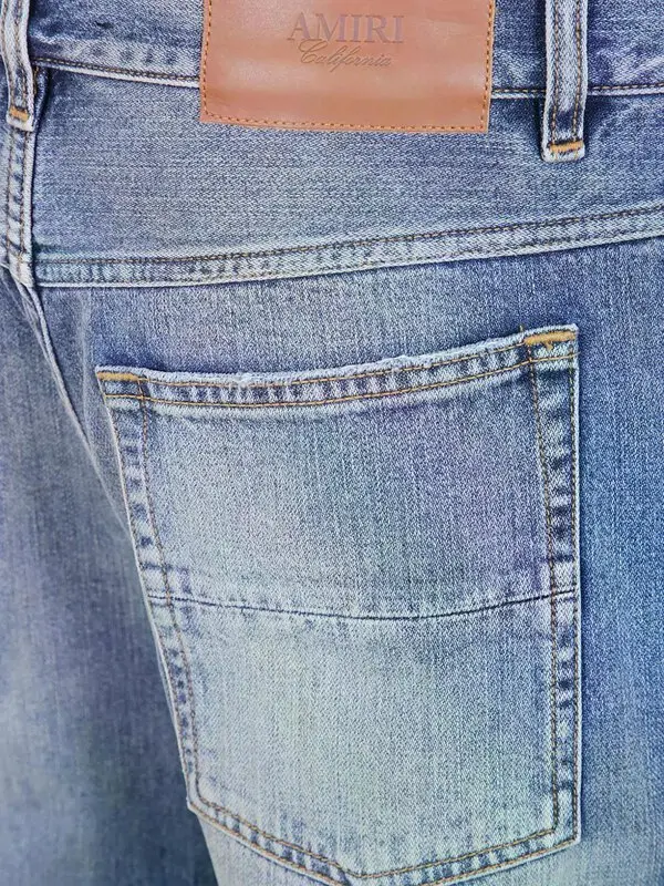 Amiri Faded Flared Jeans