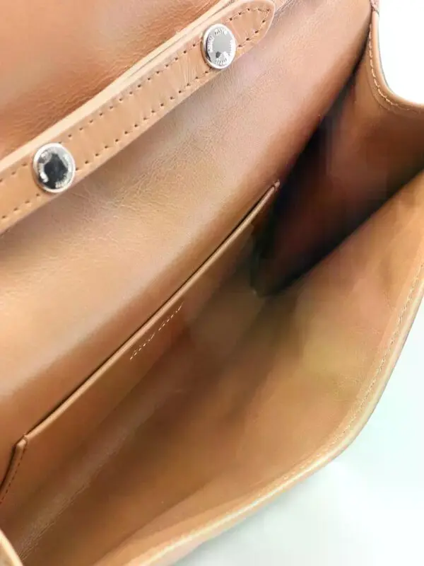 Miu Miu Logo-embossed Leather Clutch Bag