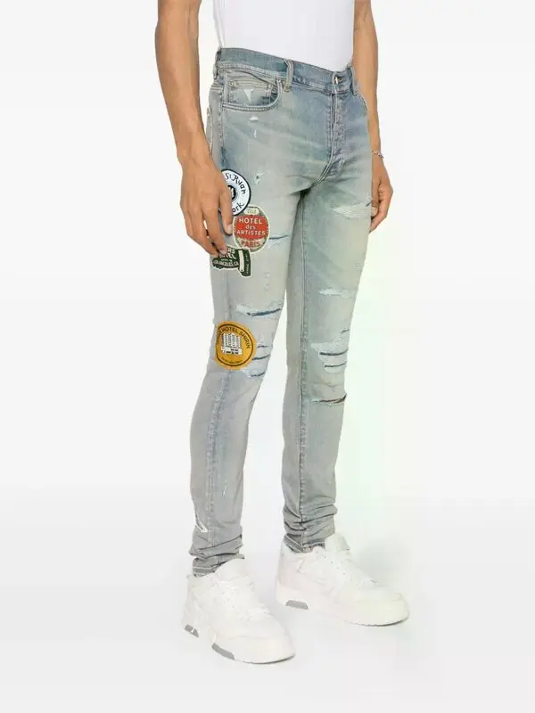 Amiri Travel Patch Repair Skinny Jeans