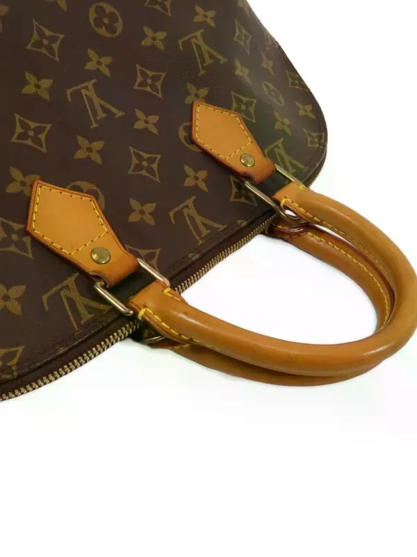 LOUIS VUITTON Alma Monogram Handbag