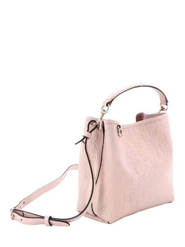 Gucci Gg Emblem Gg Embossed Leather Small Bucket Bag - Pink