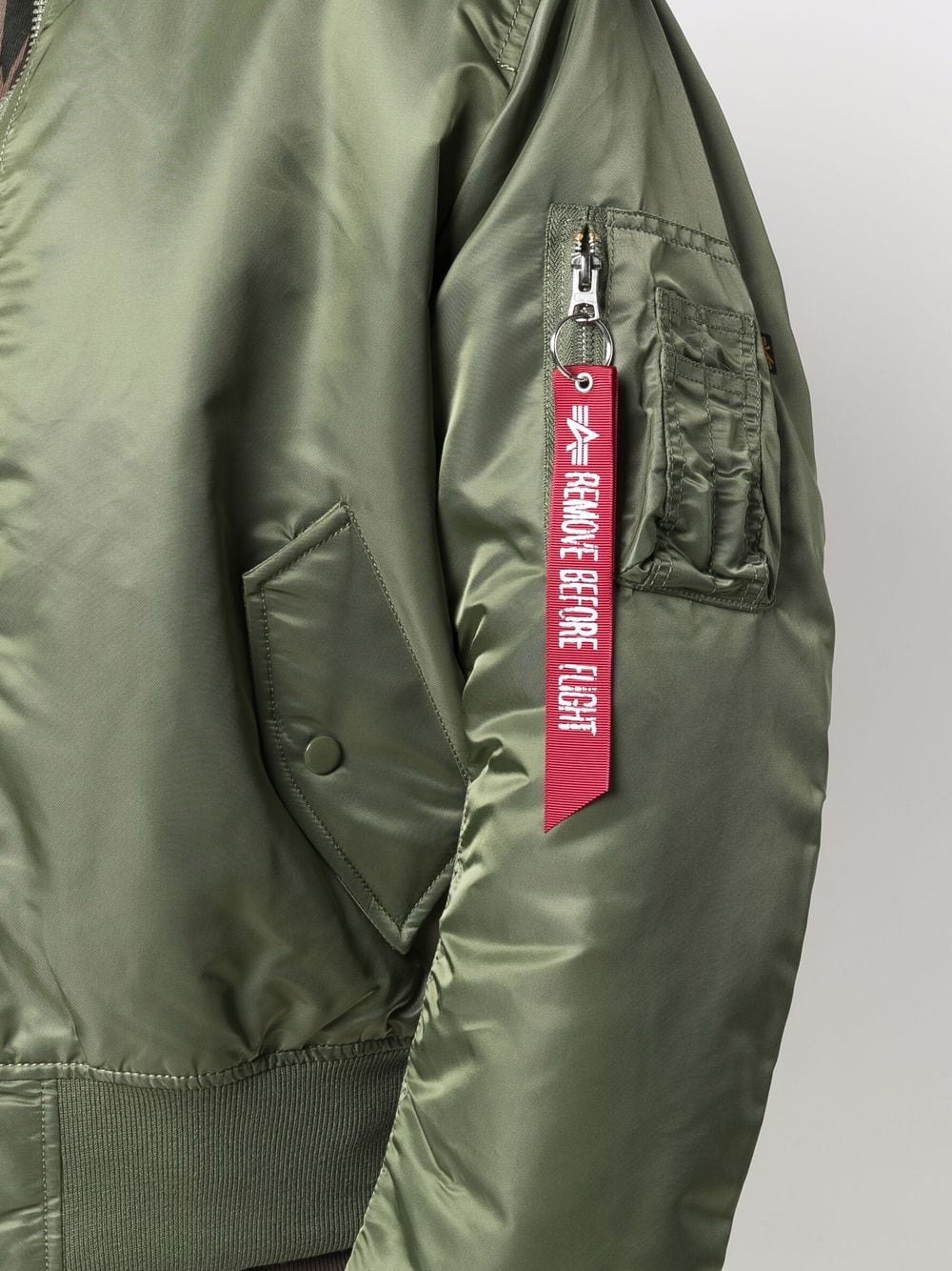 bomber jacket with red tag