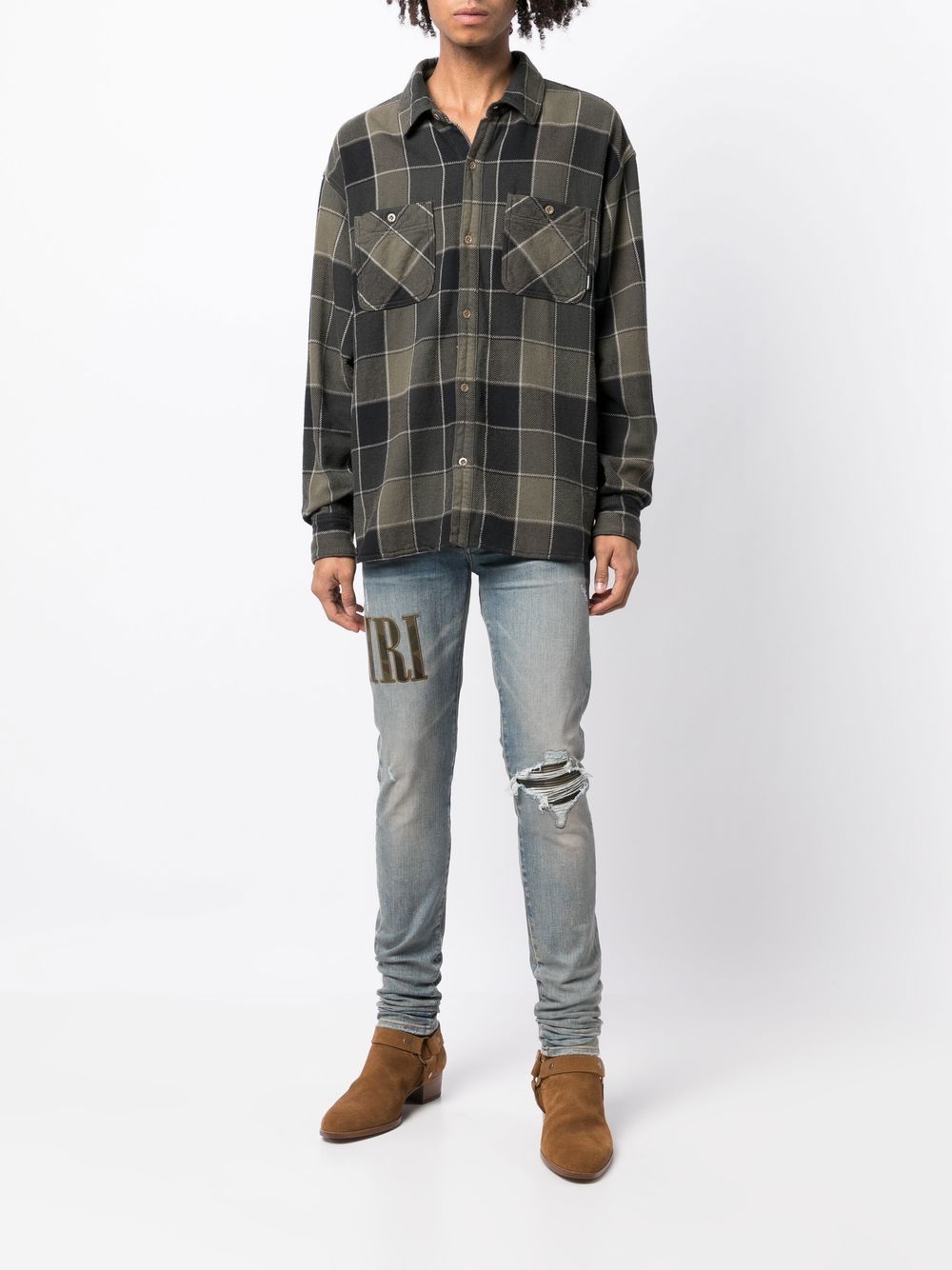 AMIRI AMIRI Logo-Embroidered Ripped Slim Cut Jeans