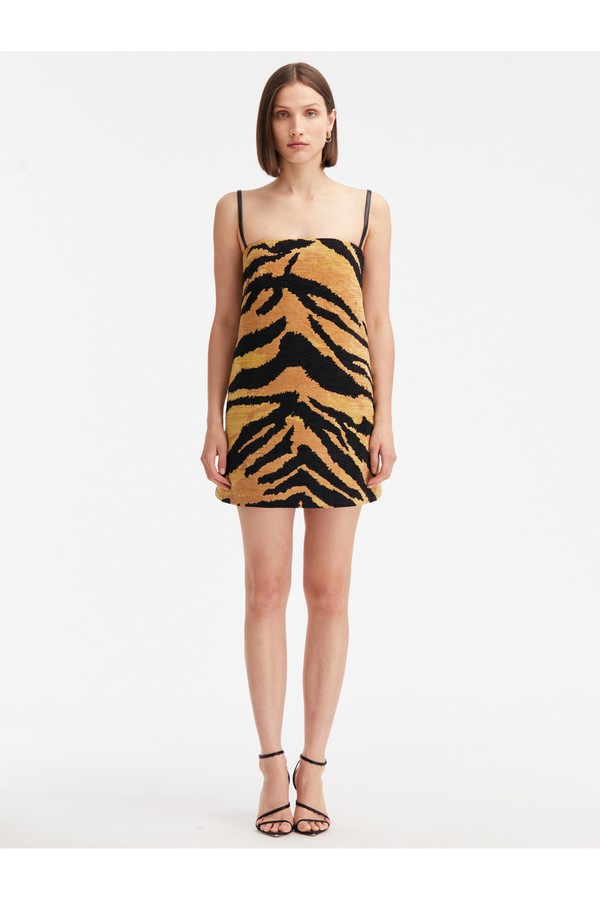 oscar de la renta tiger mini dress Eye of the tiger. The #odlrprespring2024 chenille tiger jacquard mini boasts a textured finish and a relaxed silhouette, contrasted by leather shoulder straps. Tap to shop and click the link in bio