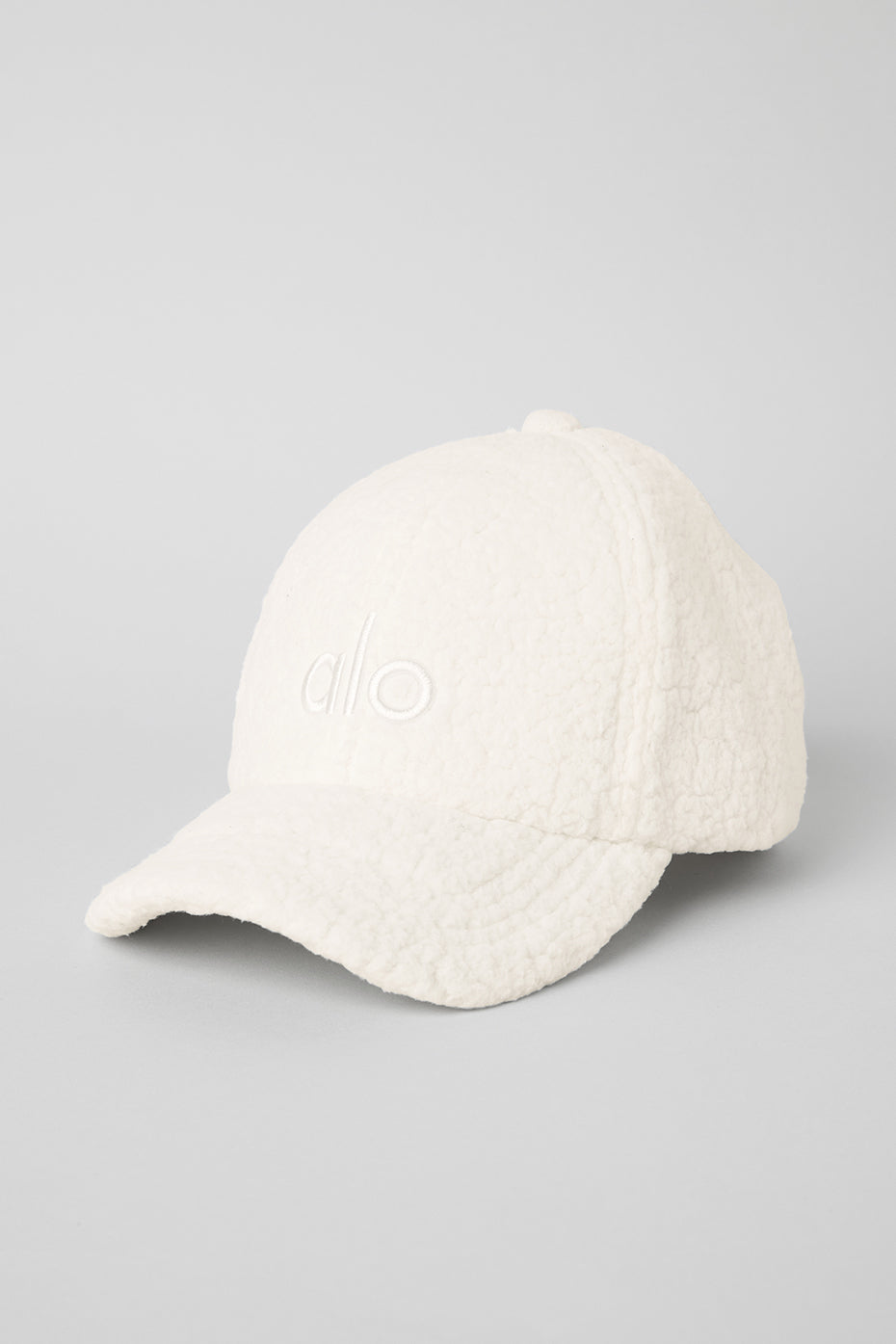 Alo Yoga Micro Sherpa Off-Duty Cap In White - Ivory | Editorialist