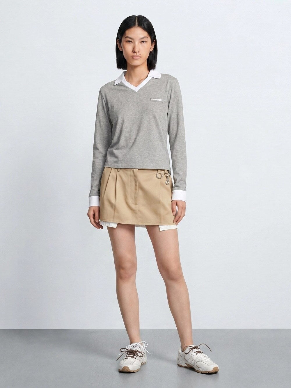 MIU MIU Miu Miu Cotton Chino Mini Skirt with Silver-Tone Charm Detail