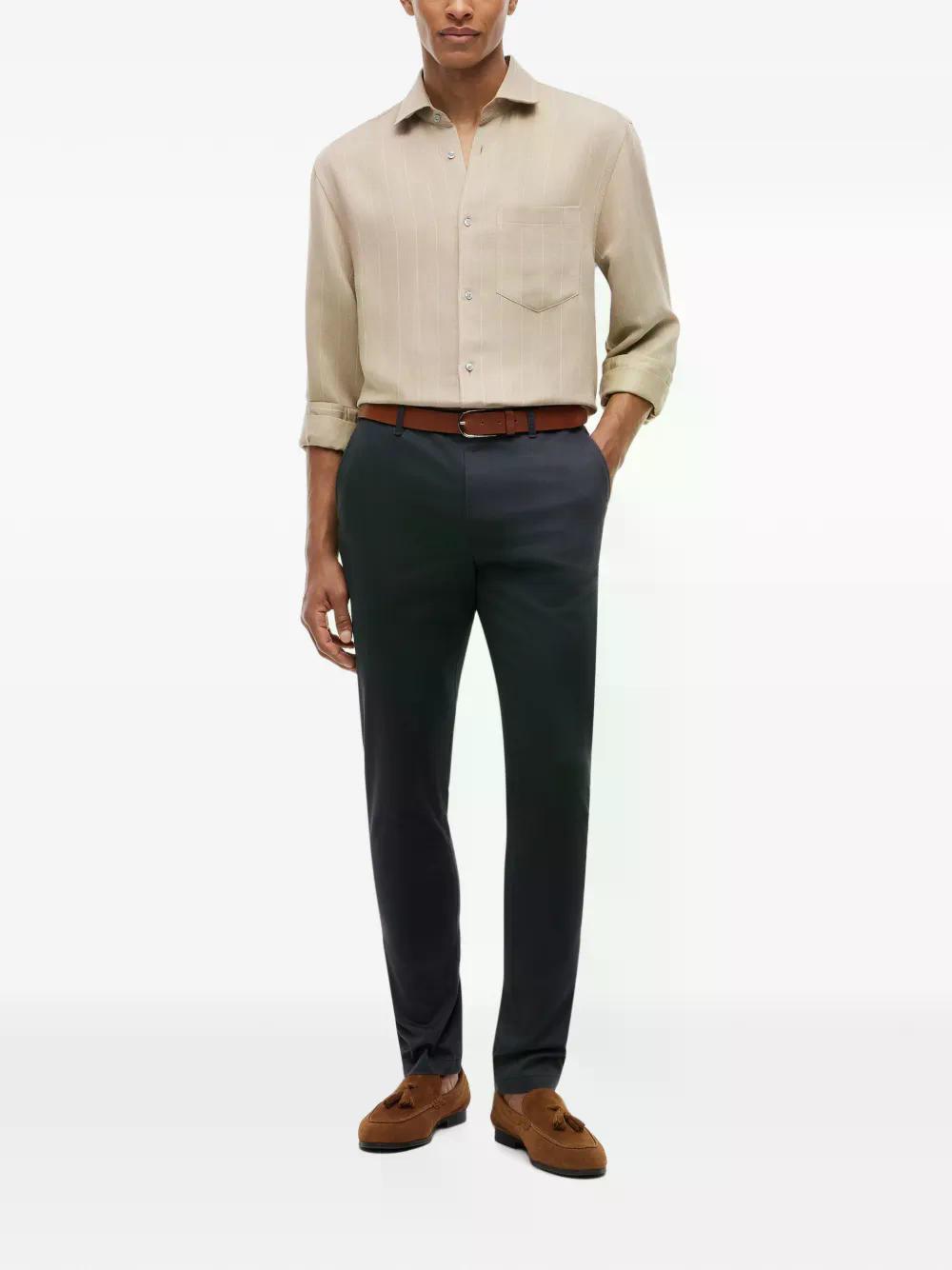 TOMMY HILFIGER logo-patch chino trousers