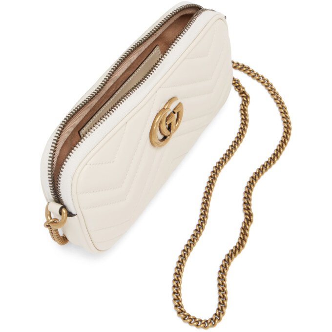 white gucci purse with gold chain
