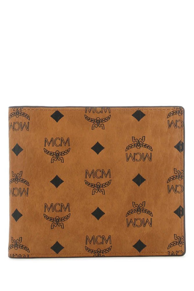 Mcm All-Over Logo Printed Bi-Fold Wallet In Brown - 23% Off | Editorialist