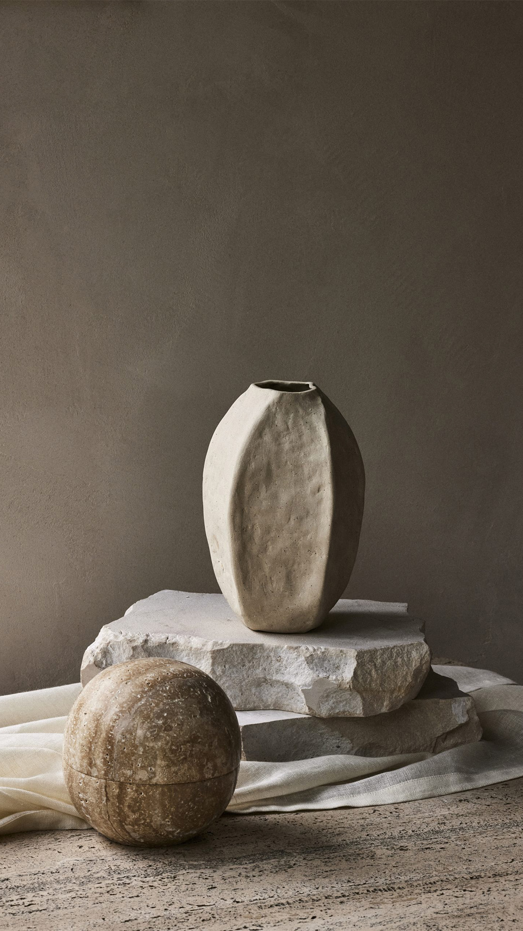 a signe ceramics vase is displayed on a tabletop