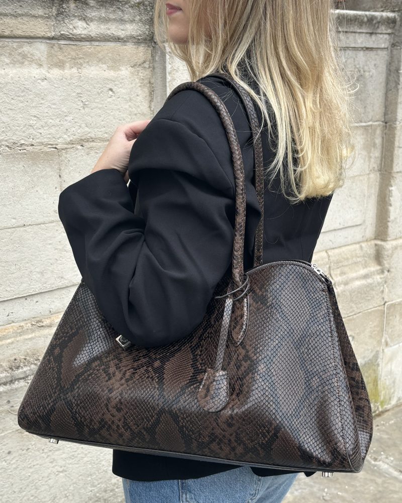 Pret-a-Porter handbag in rich brown python print%2C styled with a black oversized blazer and casual jeans for a chic look