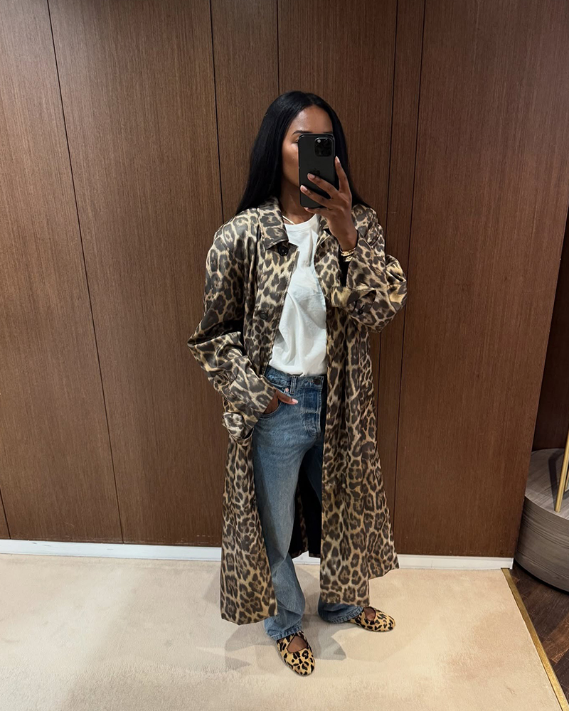 Leopard print trench coat styled with white T-shirt%2C straight-leg jeans and matching flats in mirror selfie