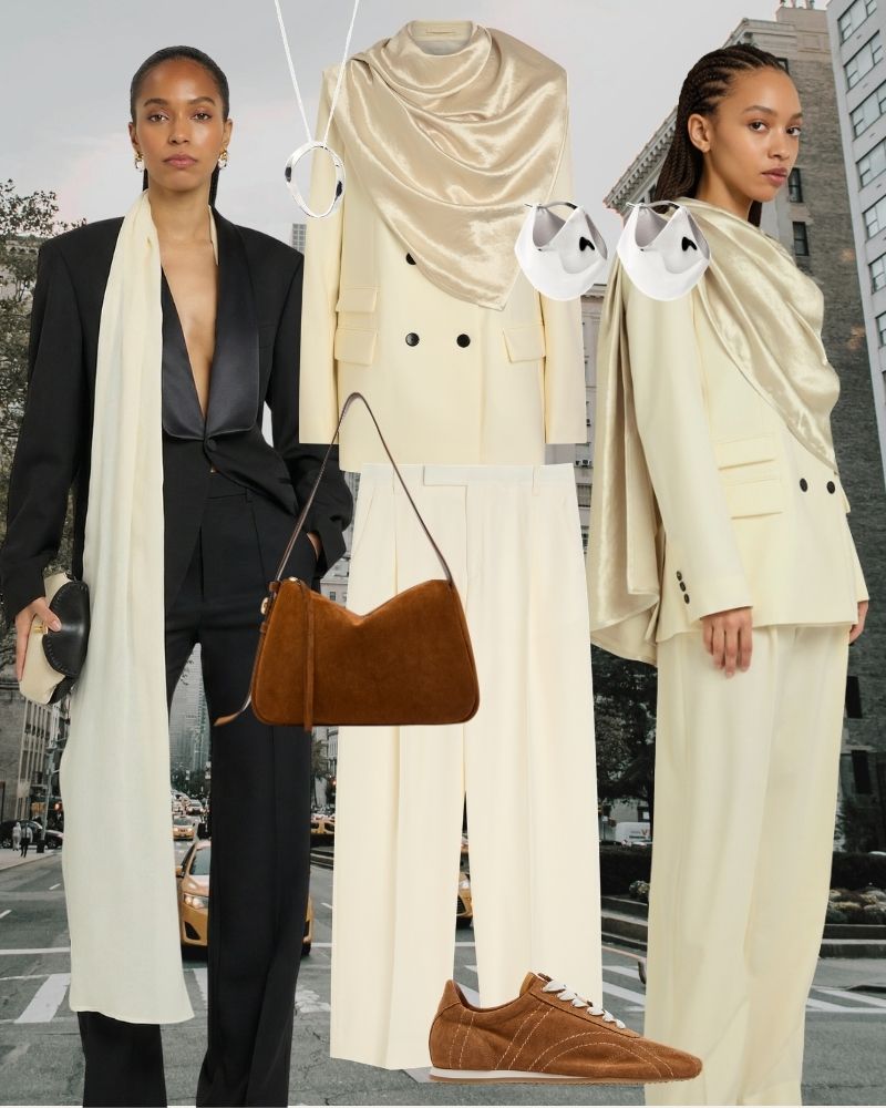 Cream tailored suit and black tuxedo blazer styled with silk scarf%2C suede shoulder bag and sneakers against city backdrop