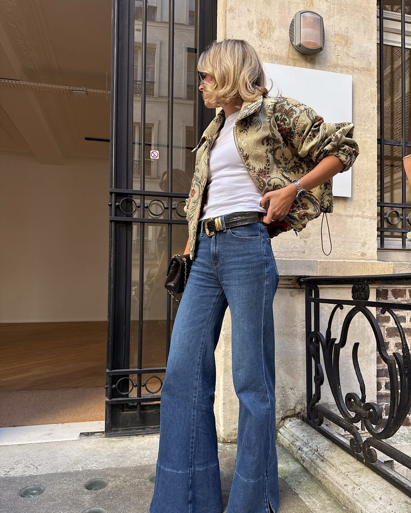 Floral jacquard bomber jacket paired with a classic white tee and wide-leg jeans%2C showcasing a chic street style ensemble.