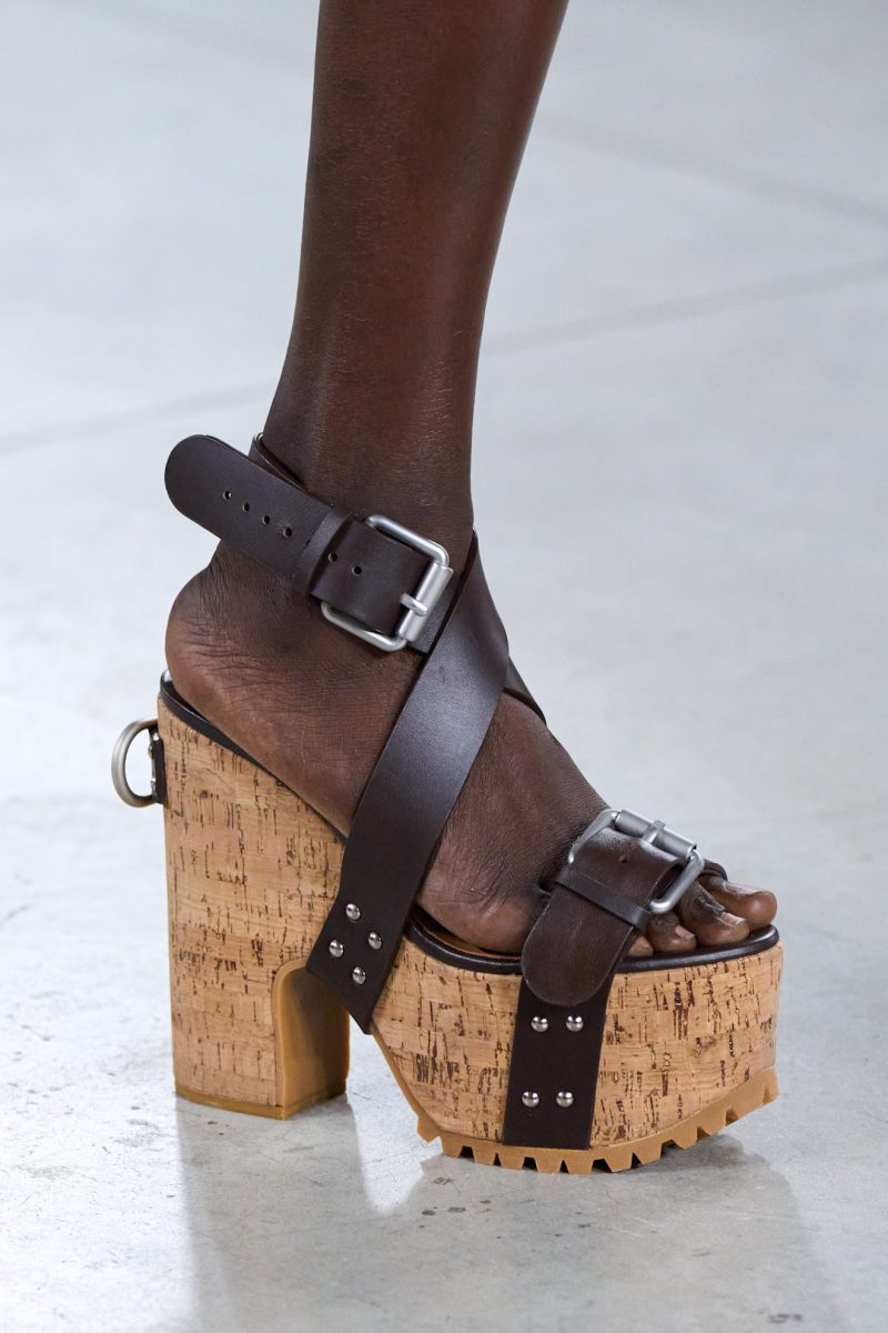 Moschino platform sandals with cork block heel, dark brown leather straps, silver buckles, and studded detailing
