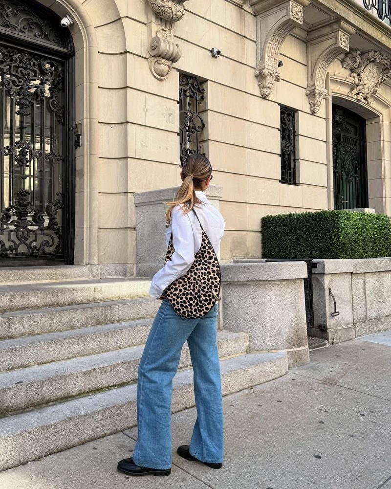 Casual street style with crisp white shirt%2C wide-leg blue jeans and leopard print tote bag%2C styled for effortless city look