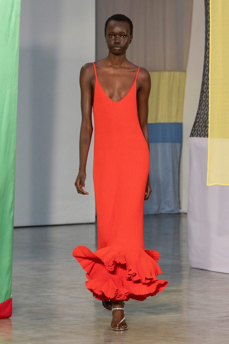 Proenza Schouler sleeveless red ribbed knit maxi dress with deep v-neck and ruffled hem for spring summer runway