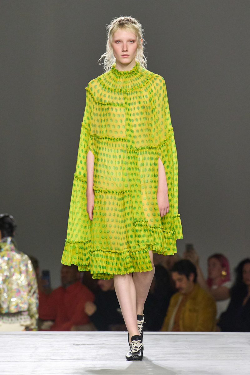 Sheer lime green polka dot cape dress with ruffled hem and high neck from Dries Van Noten spring summer 2026 collection