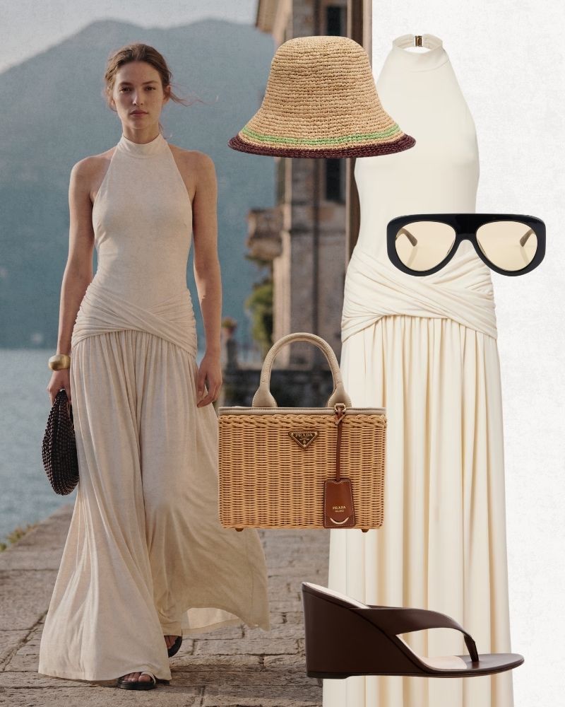 Prada woven tote bag styled with a cream halter maxi dress%2C wedge sandals and raffia hat by a lakeside backdrop