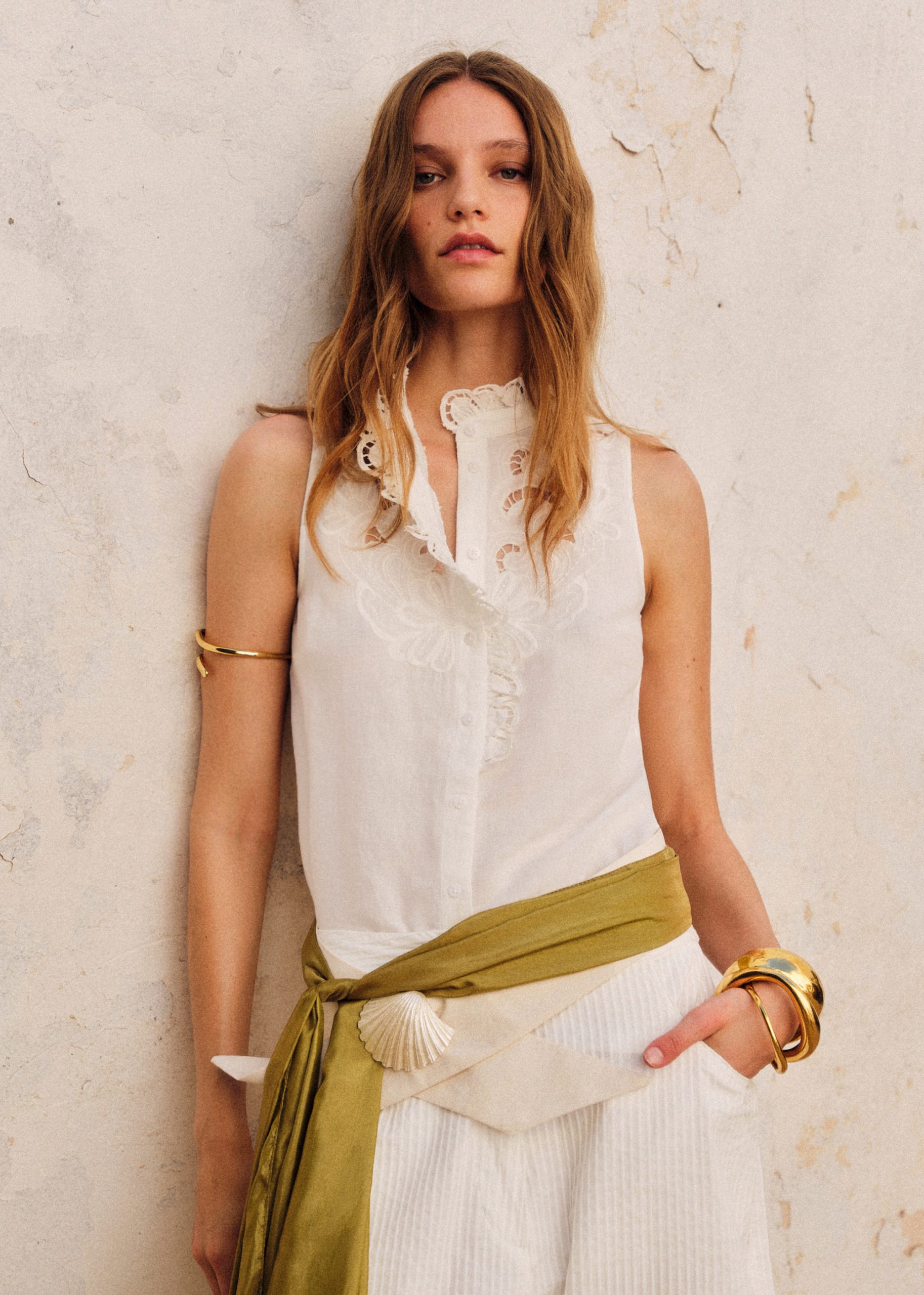 Doen SASKY blouse in ecru features delicate broderie detailing and a soft collar%2C styled with a green wrap for a fresh%2C ethereal look