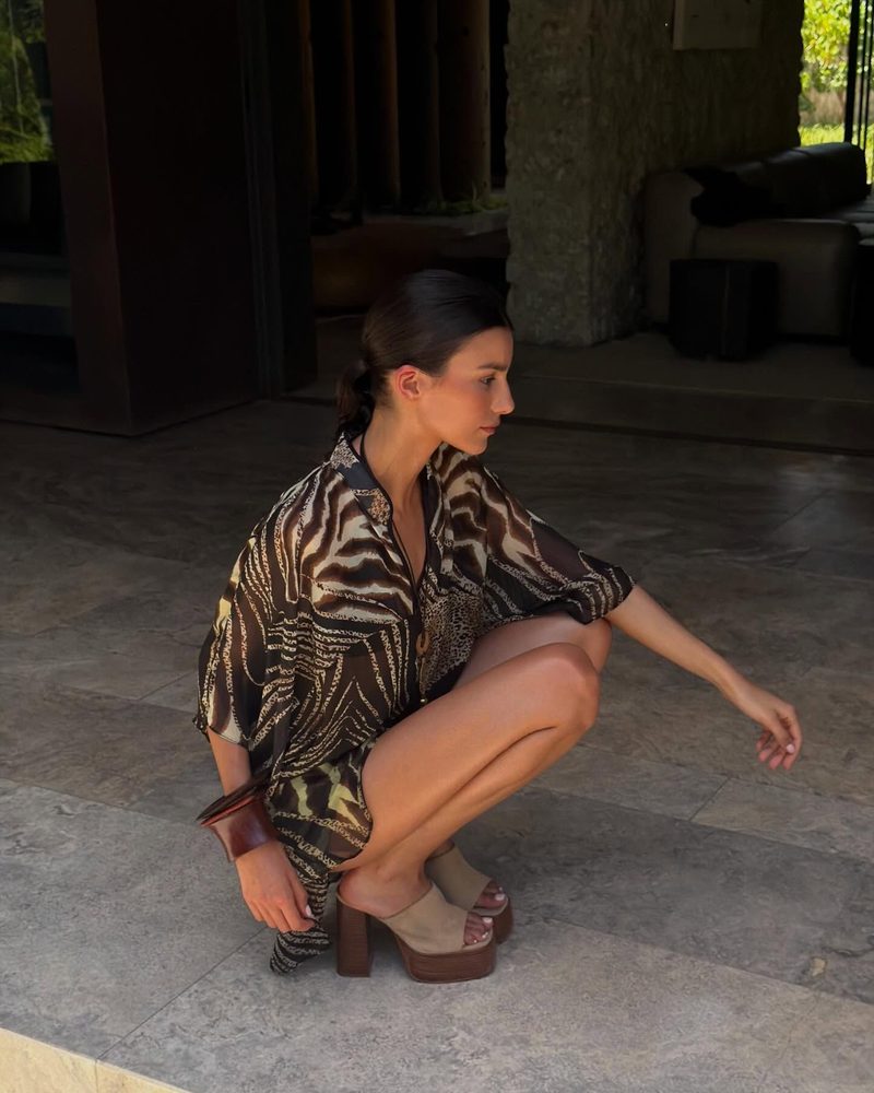 Suede block-heel sandals in beige%2C styled with a printed oversized shirt dress featuring earthy tones%2C perfect for summer outings