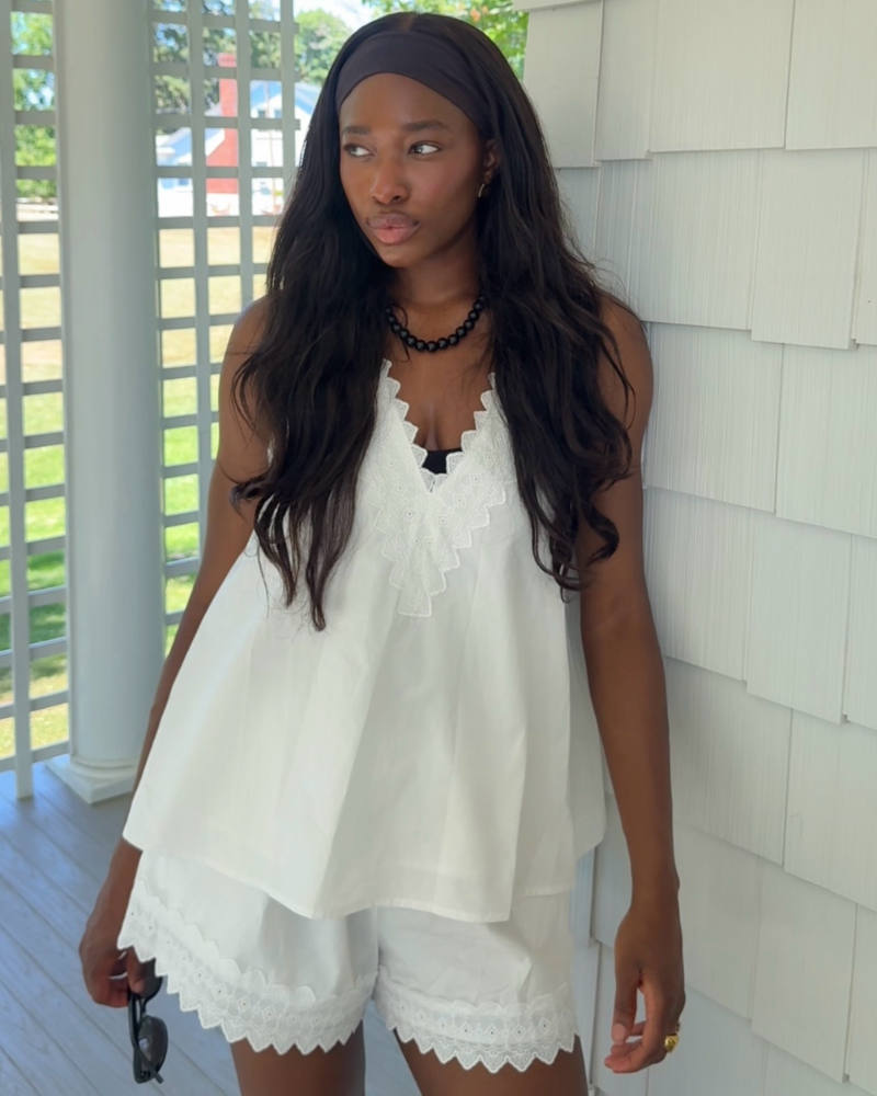 White summer outfit featuring a sleeveless lace-trimmed top paired with matching shorts%2C accessorized with a black headband and sunglasses