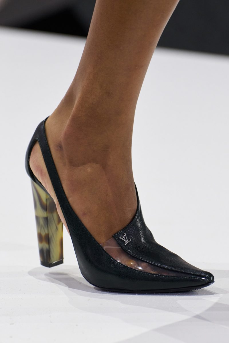 Black Louis Vuitton slingback pump with pointed toe, transparent side panels, and tortoiseshell block heel