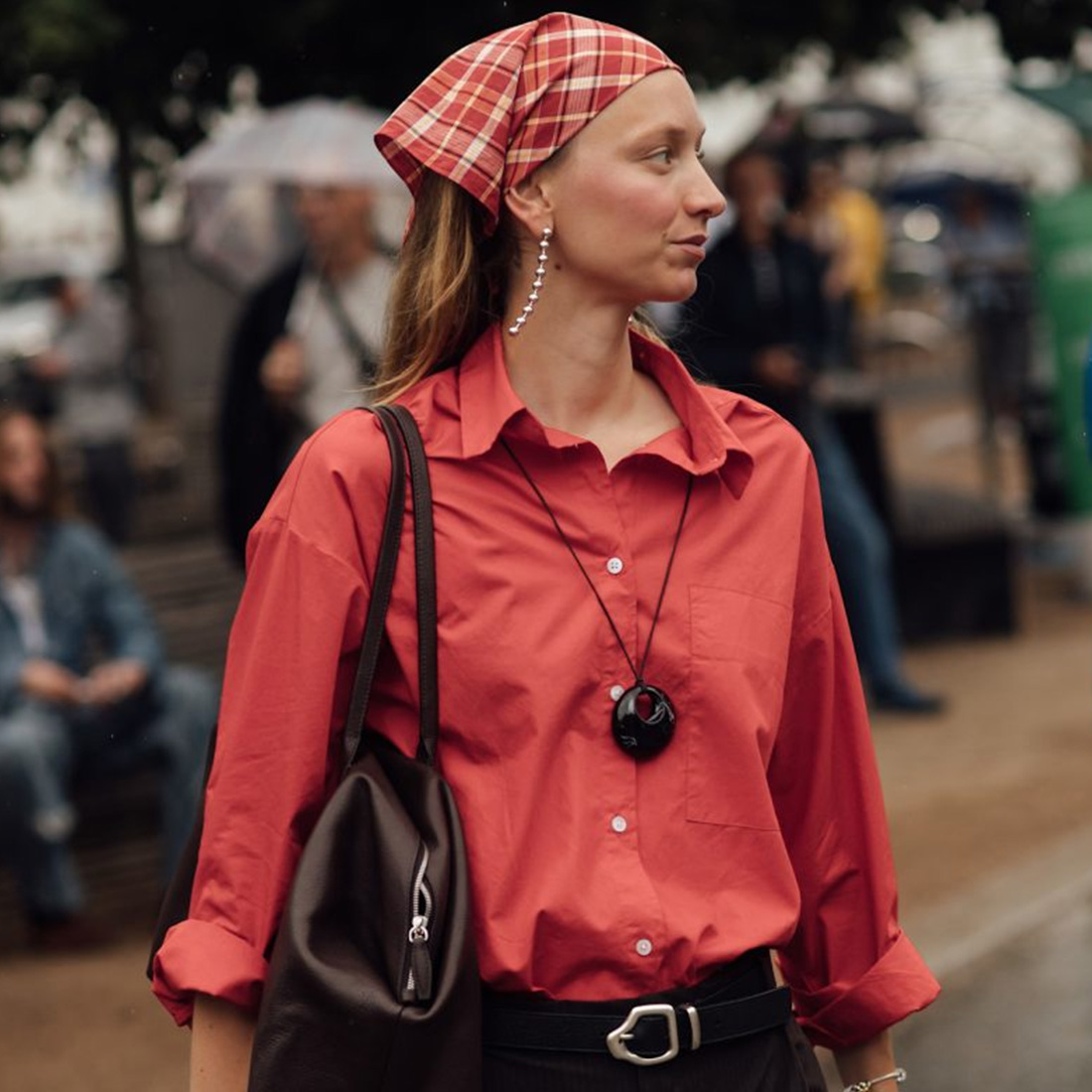 Street style collage featuring oversized shirts, breezy dresses, shoulder bags, and sunglasses on city streets during summer fashion week