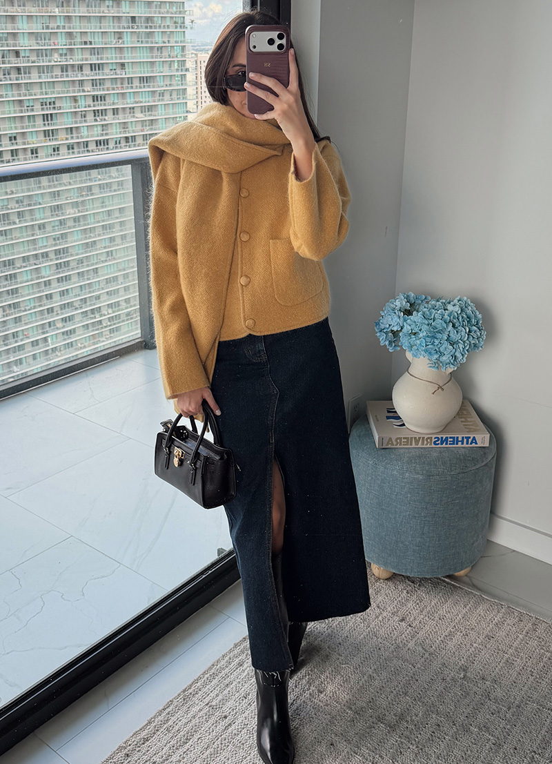1. Mustard textured jacket and scarf paired with a black denim midi skirt and mini black handbag in a mirror selfie